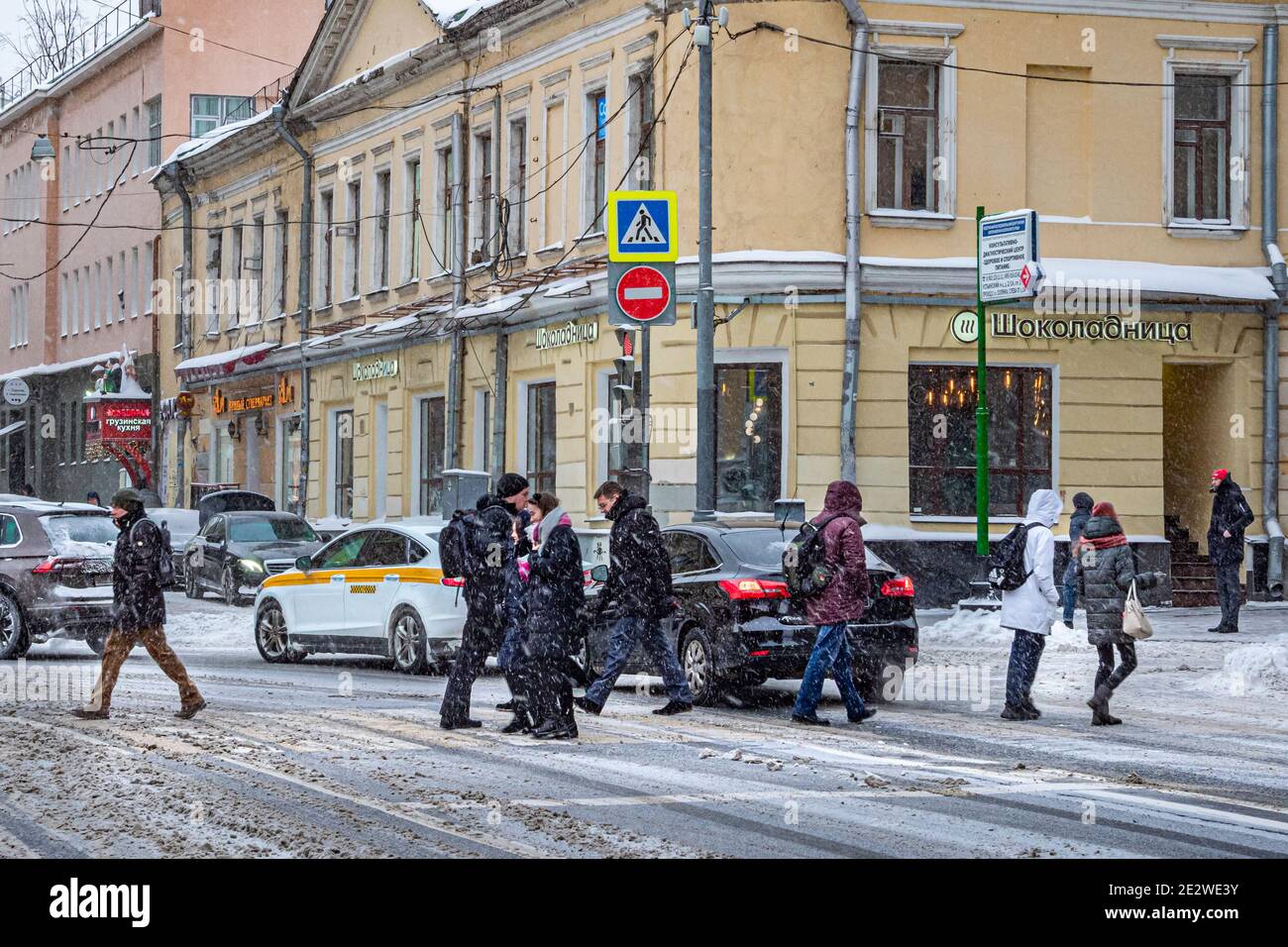 January 14, 2021. Snowfall in Moscow, Russia. People walk in a street ... January 14, 2021. Snowfall in Moscow, Russia. People walk in a street ...