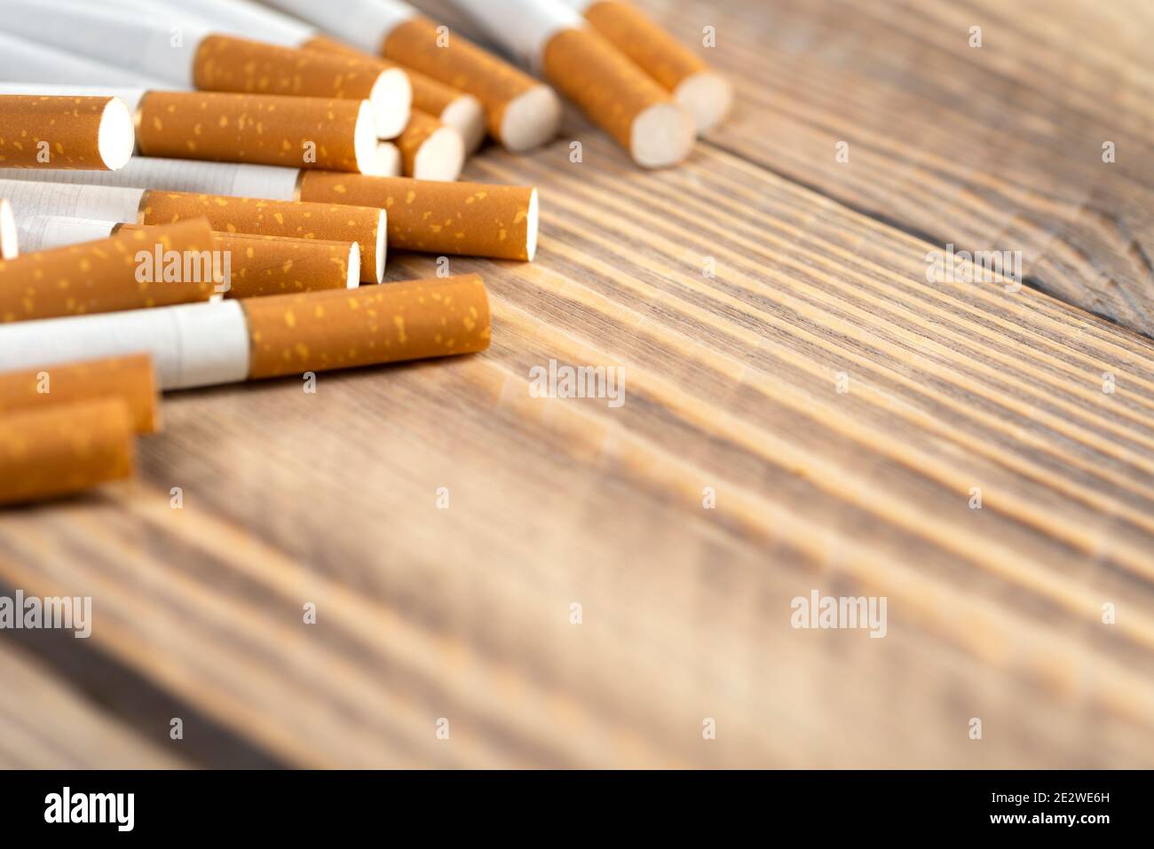 cigarettes on wooden background, close-up of a cigarette with place for ...