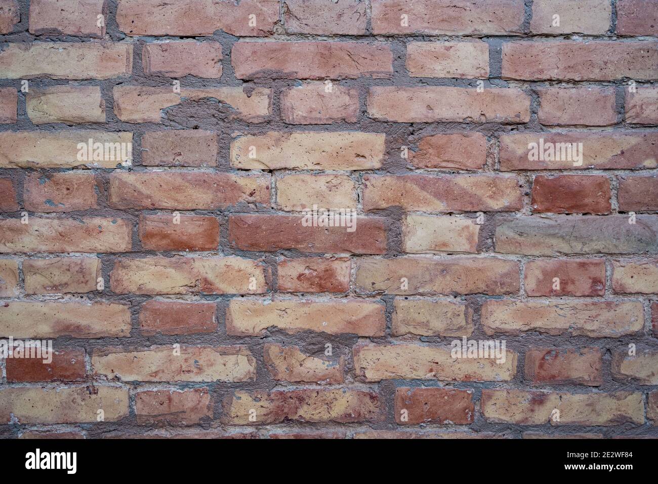 Brick wall. Texture of red brick with gray filling Stock Photo - Alamy