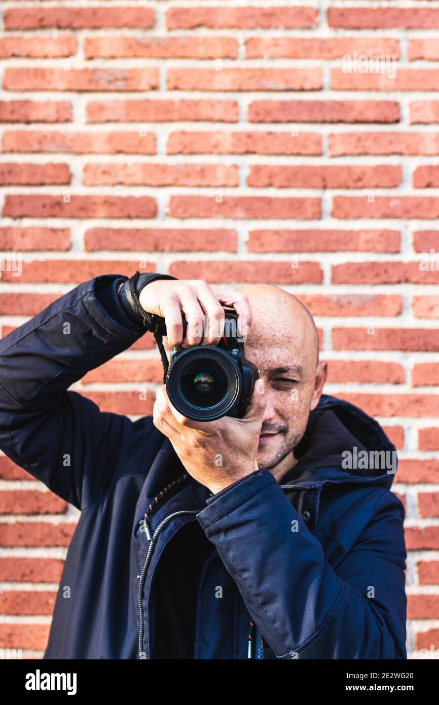 Man Photographing Looking His Camera Posing Smiling Stock Photo - Alamy