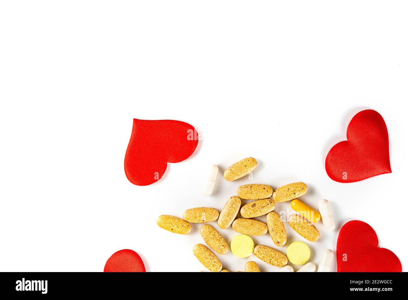 The hearts, tablets and pills isolated on white background Valentines ...