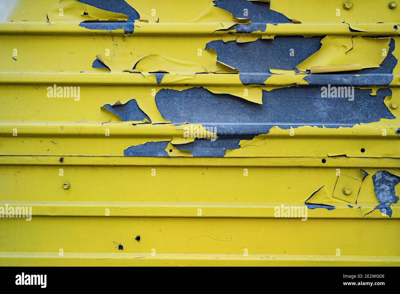 Yellow peeled iron tin fence lined background. Metal texture Stock ...