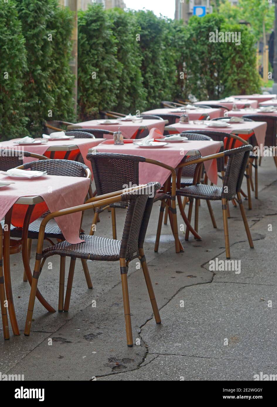 Empty outside restaurant tables setup ready Stock Photo - Alamy