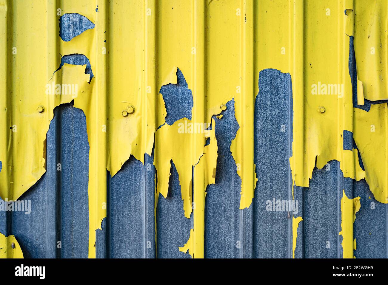 Yellow peeled iron tin fence lined background. Metal texture Stock ...