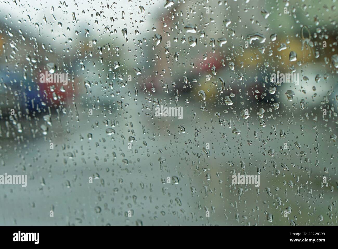 Rainy day abstract weather photo trough wet glass Stock Photo - Alamy