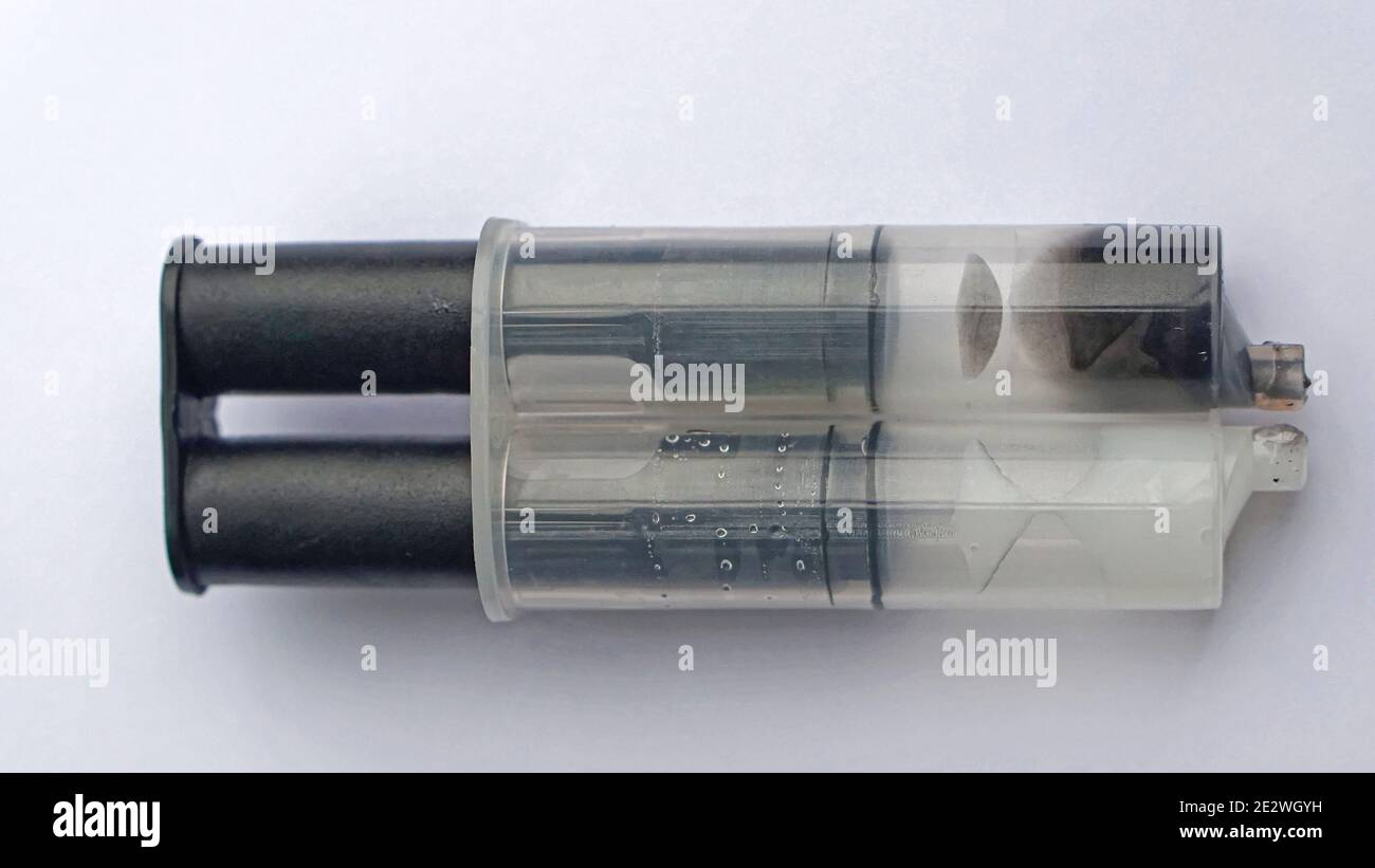 Two part epoxy adhesive glue in syringes Stock Photo - Alamy Two part epoxy adhesive glue in syringes Stock Photo - Alamy