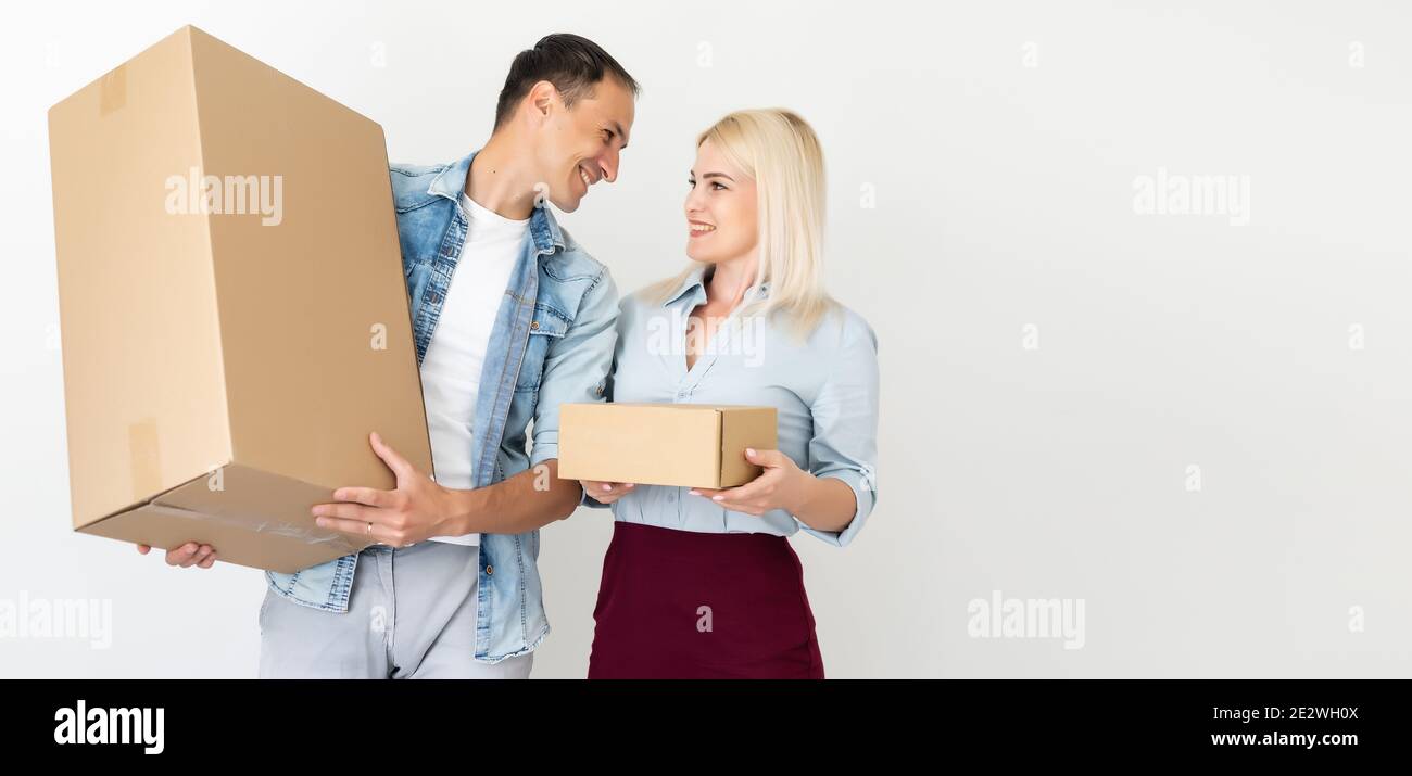 people, delivery, shipping and postal service concept - happy couple ...