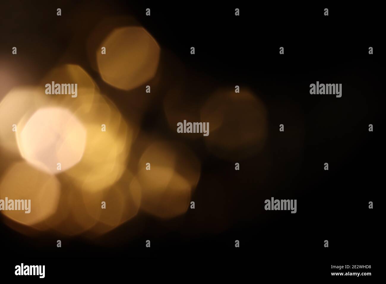 bokeh warm light on black background for overlay Stock Photo - Alamy