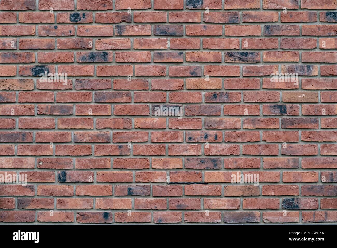 Brick wall. Texture of red brick with gray filling Stock Photo - Alamy