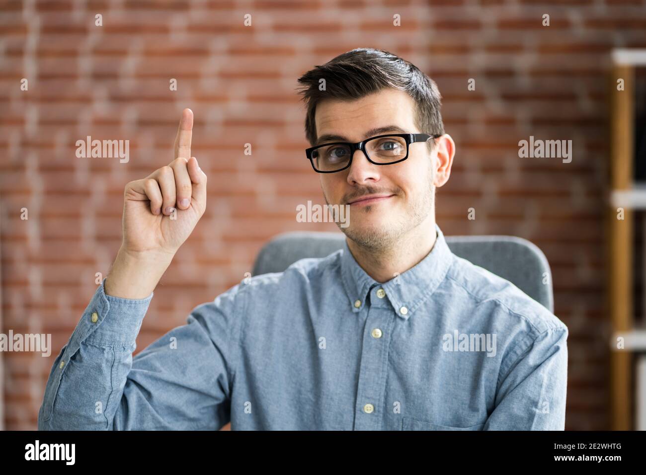 Man Raising Hand In Training Video Conference Call Stock Photo - Alamy