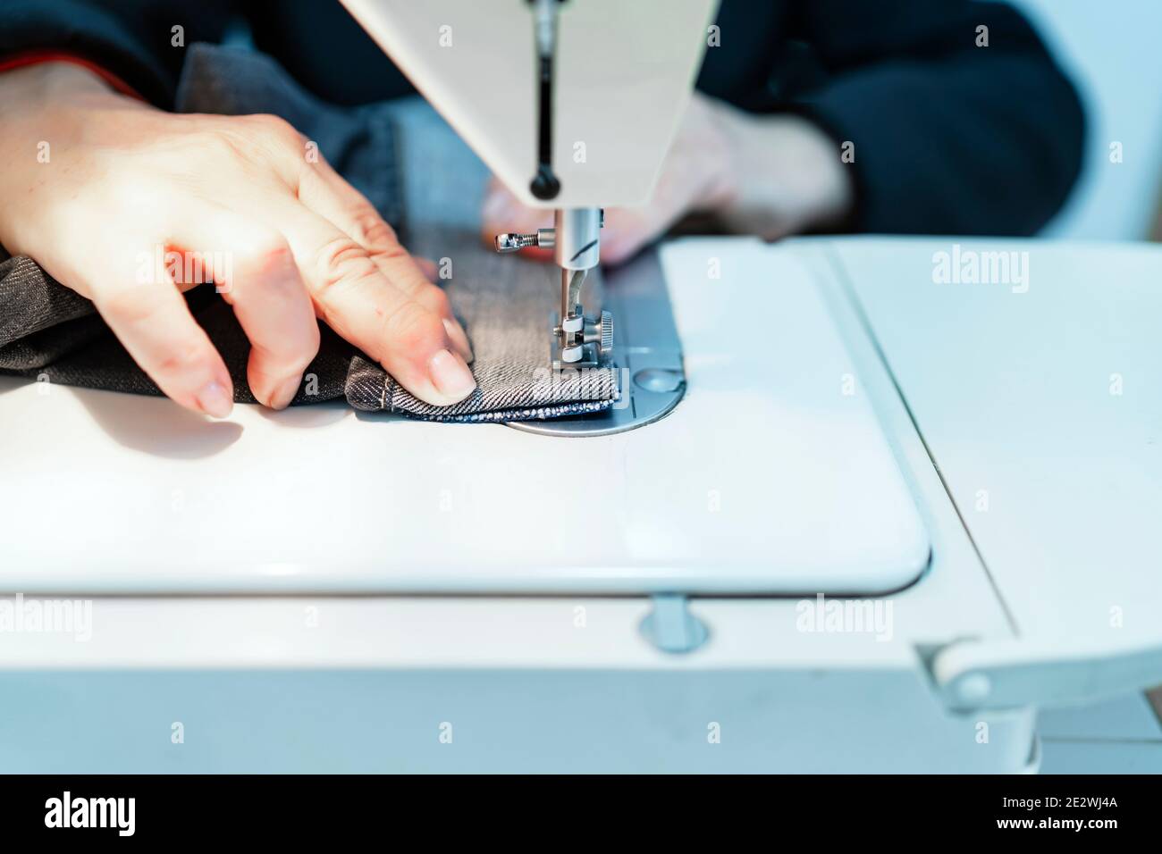 Woman using industrial sewing machine hi-res stock photography and ...