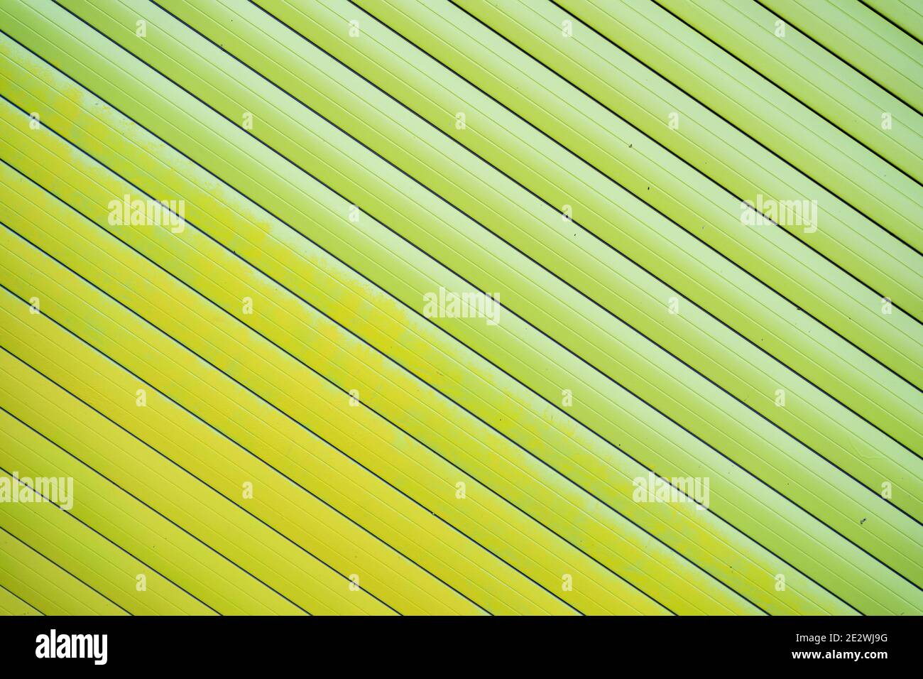 Green iron tin fence lined background. Metal texture Stock Photo - Alamy