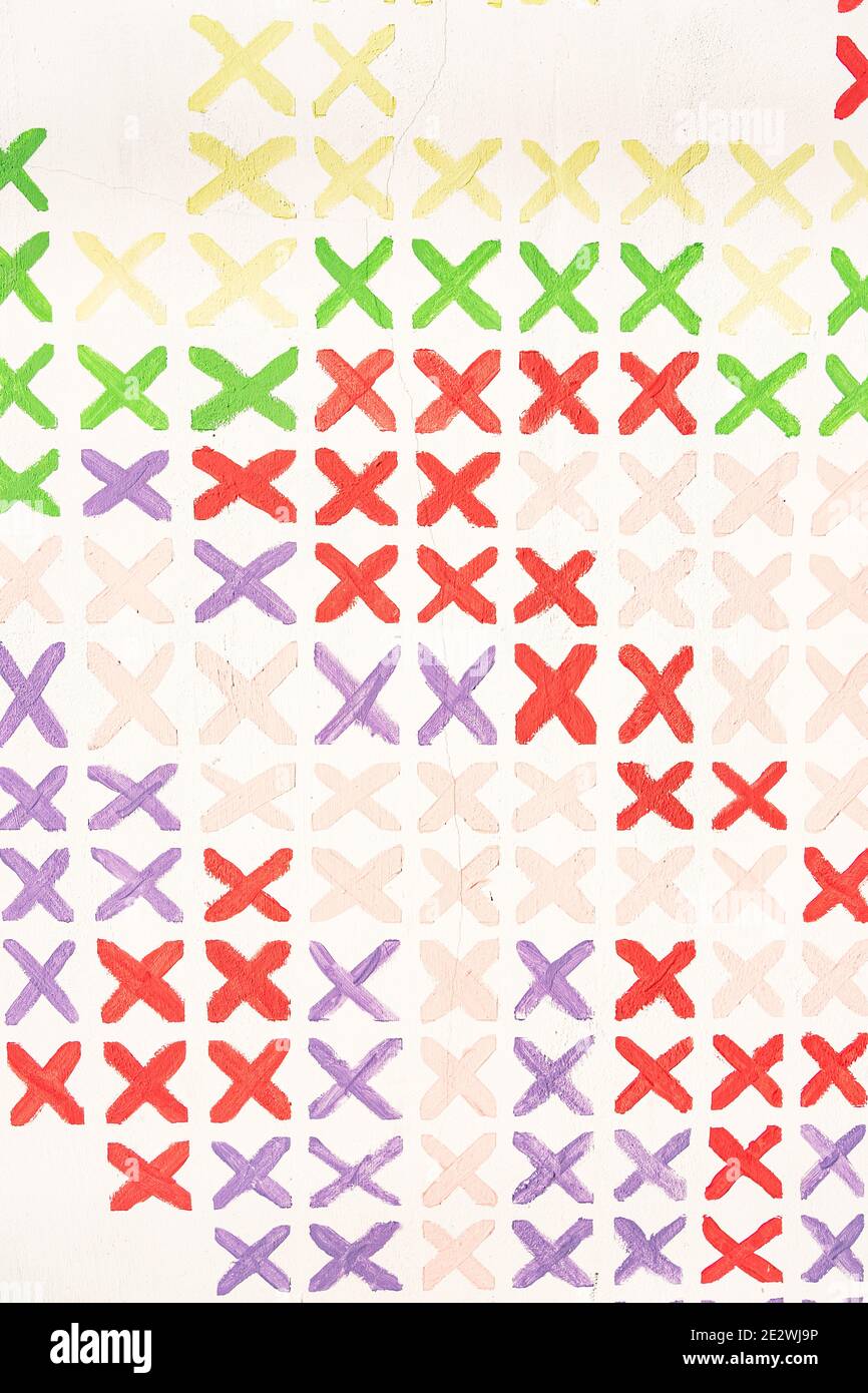 Colorful repetitive cross marks on white background Stock Photo - Alamy