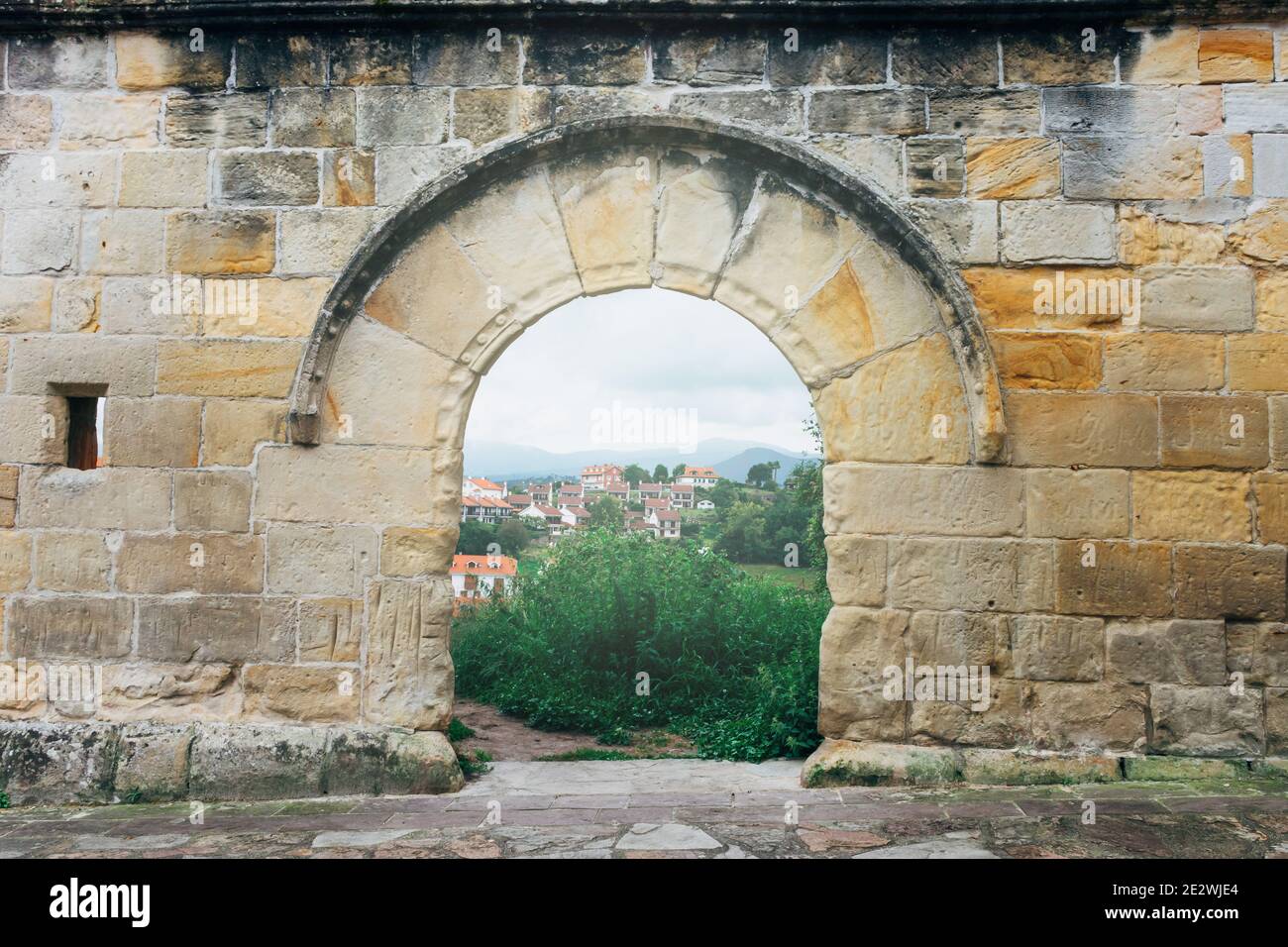 Medieval archway in a stone brick wall Stock Photo - Alamy