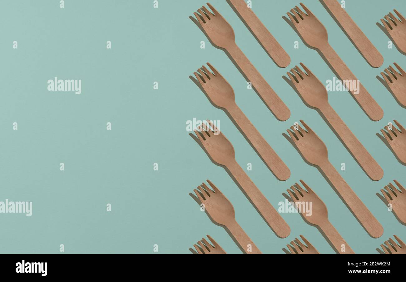 Group of wooden forks on green background with copy space Stock Photo ...