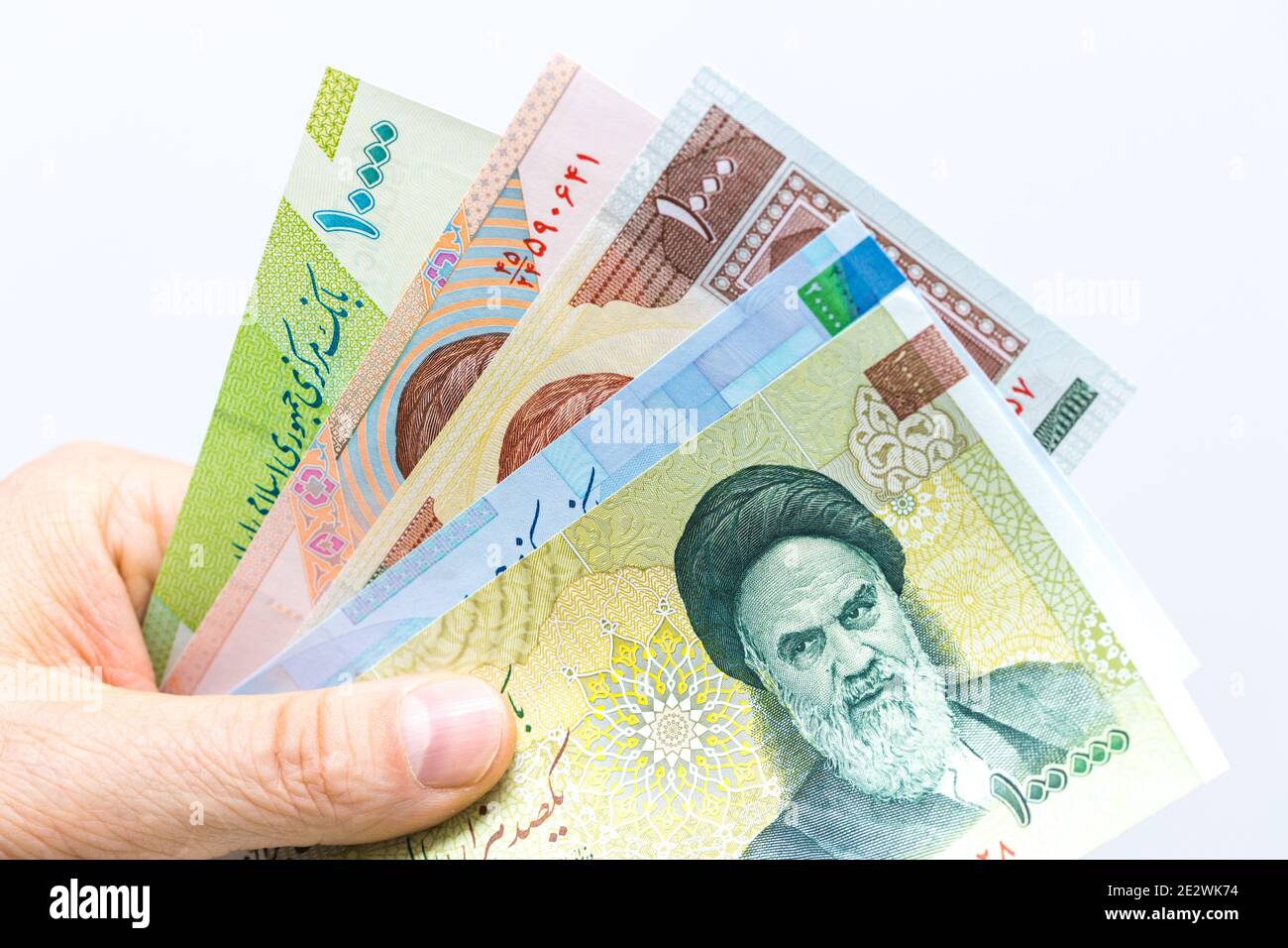 Iranian Riyal Money, Various Values, Banknotes spread out and held in ...
