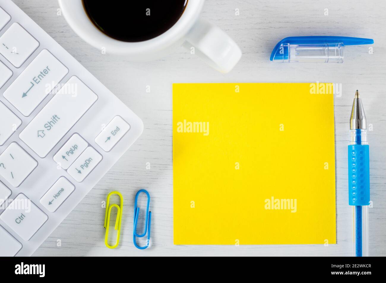 Yellow sheet of paper with space for text. Office accessories, computer ...