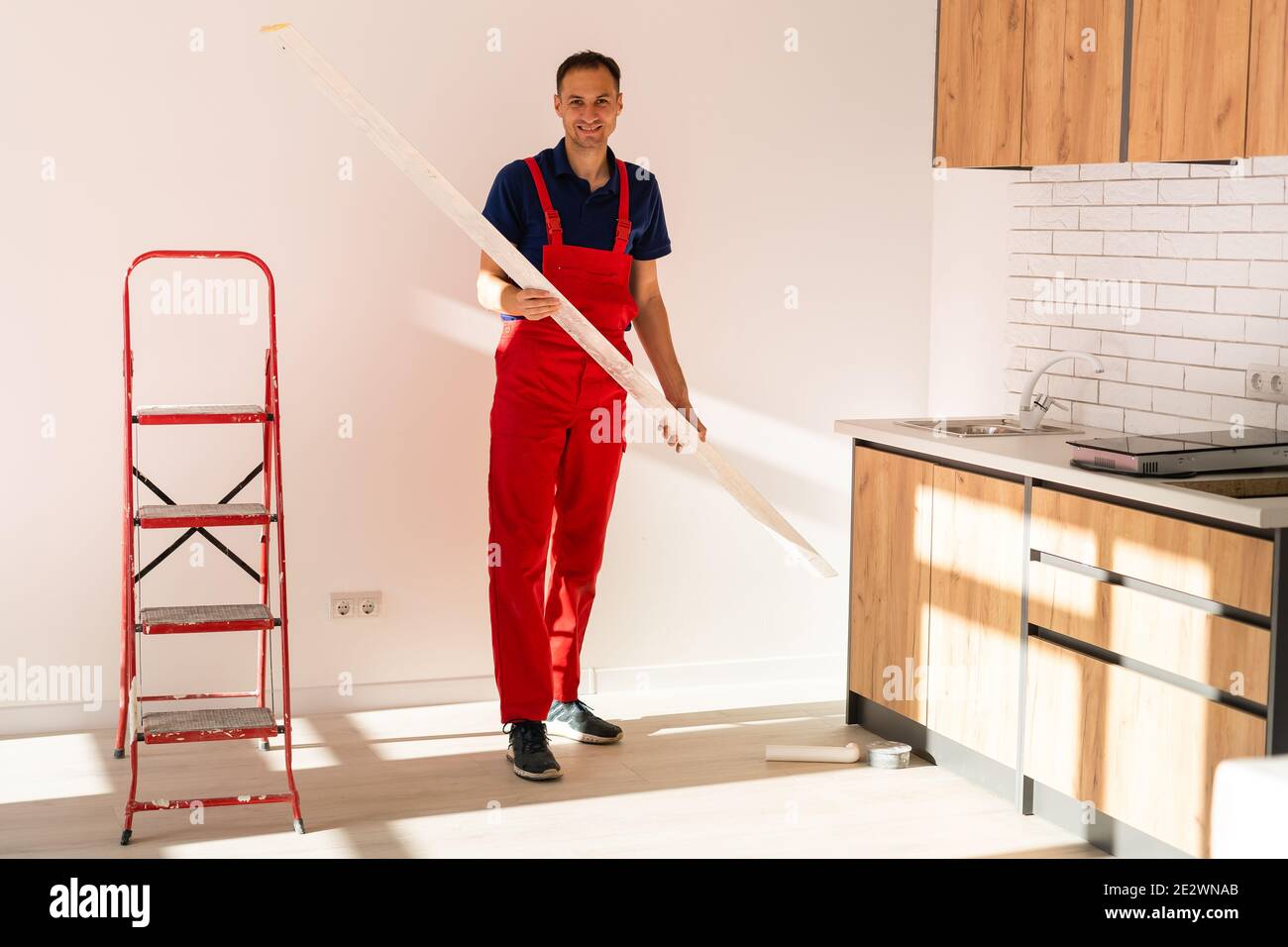 Rear back behind view photo of unrecognizable repairman master using ...