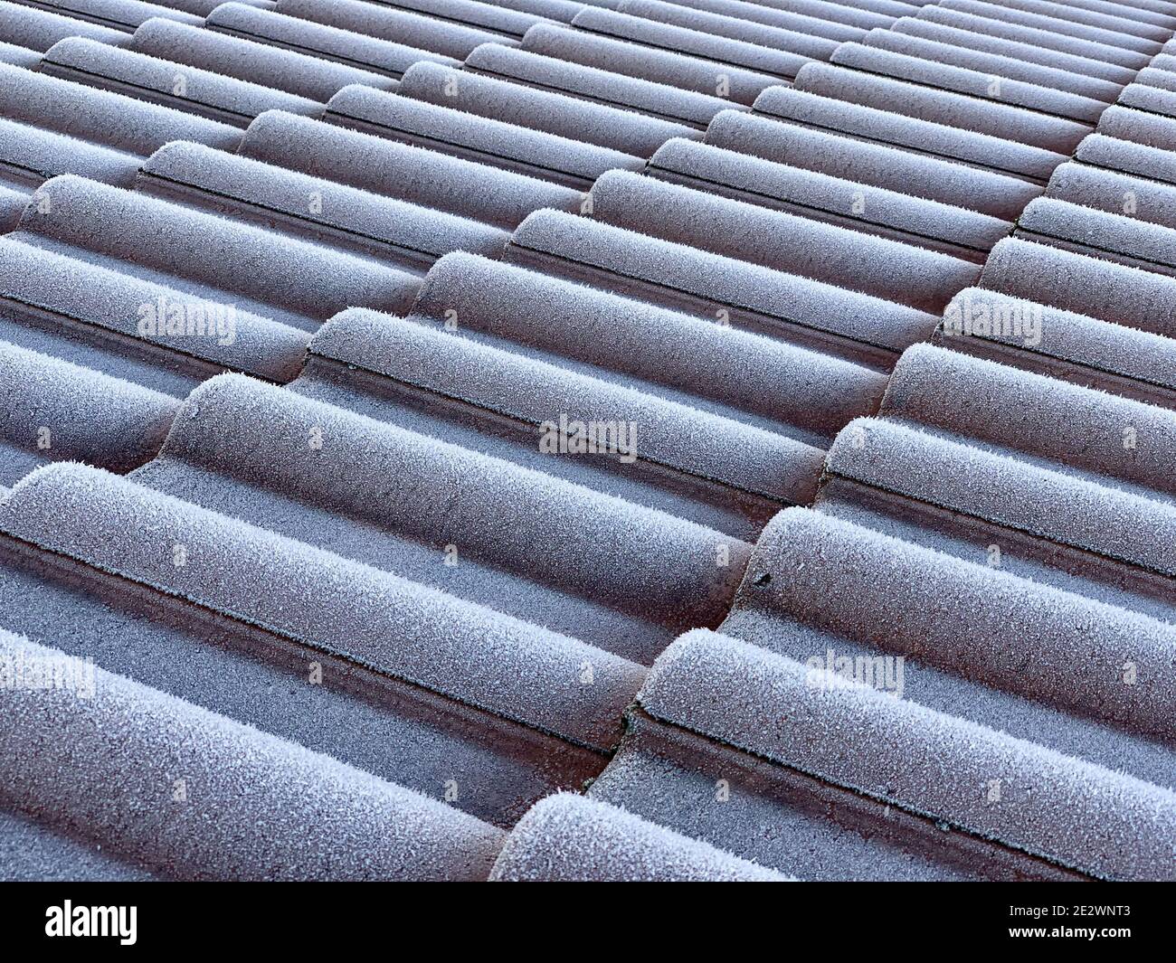 Closeup shot of concept for roof housetop icon with grey roofing tiles ...