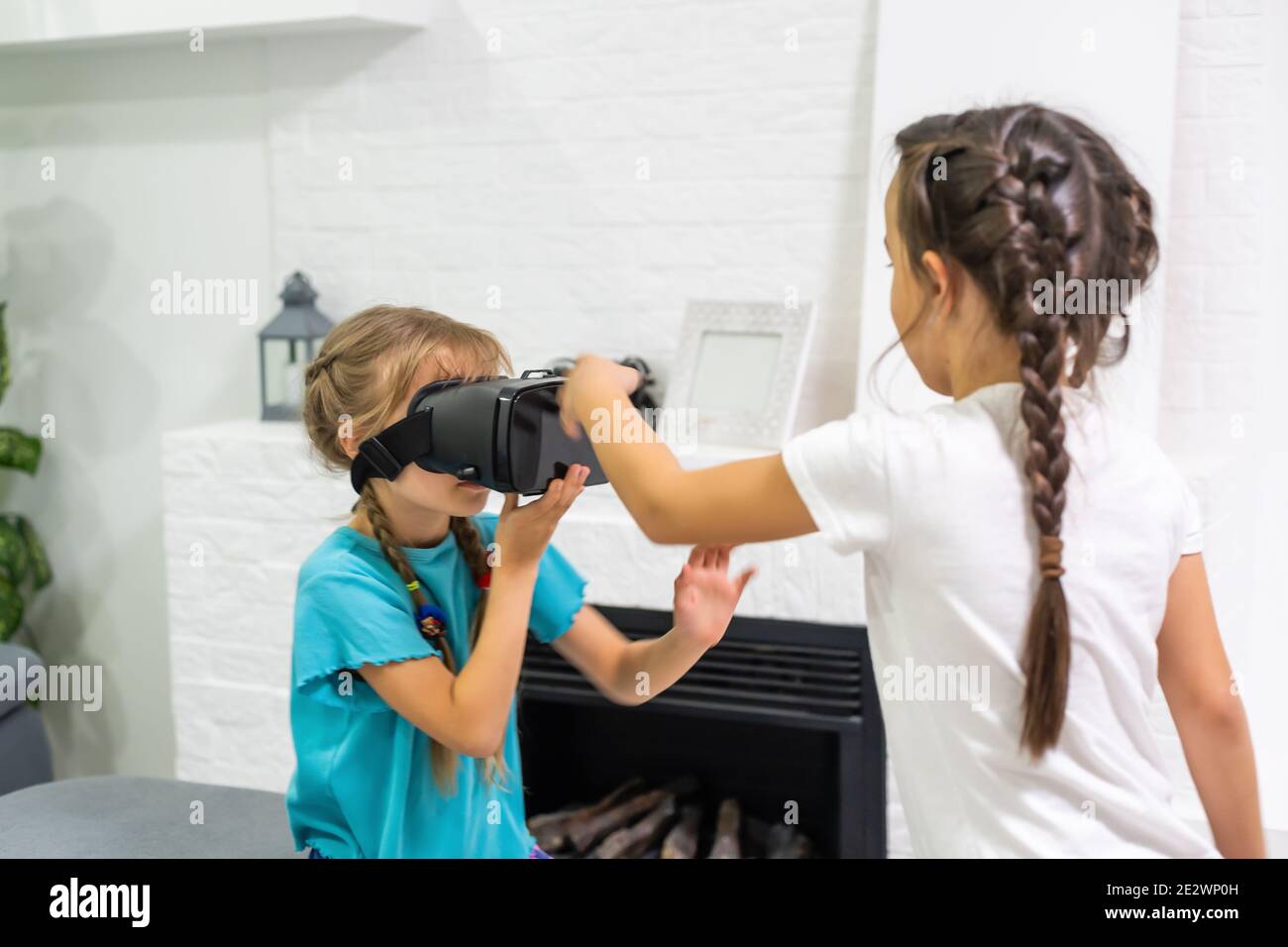 two little girls using glasses of virtual reality headset. concept of ...
