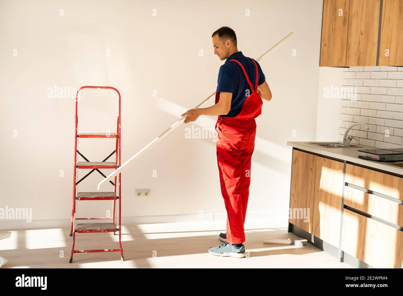 Rear back behind view photo of unrecognizable repairman master using ...