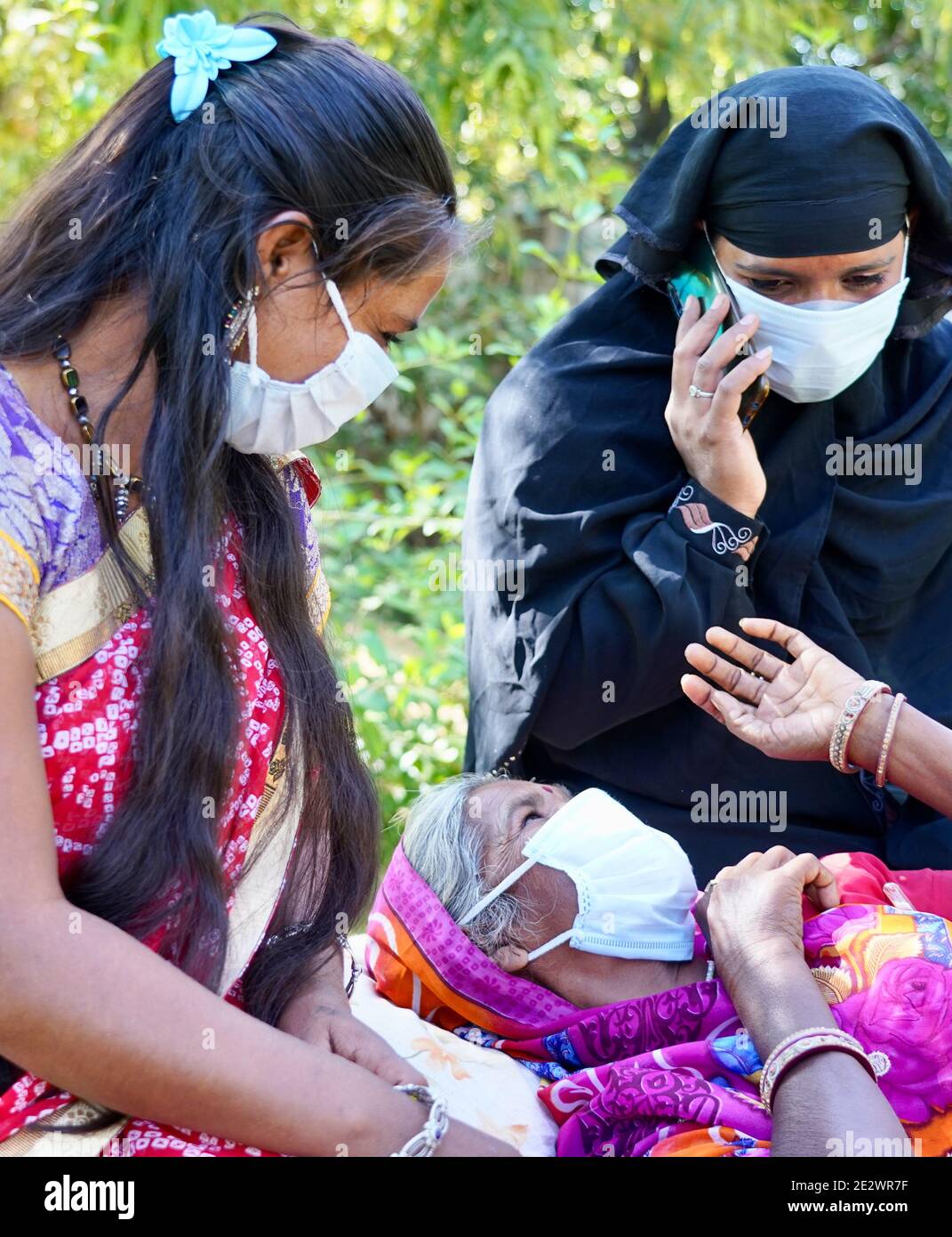 Vertical shot of Indian women calling for an ambulance Stock Photo - Alamy