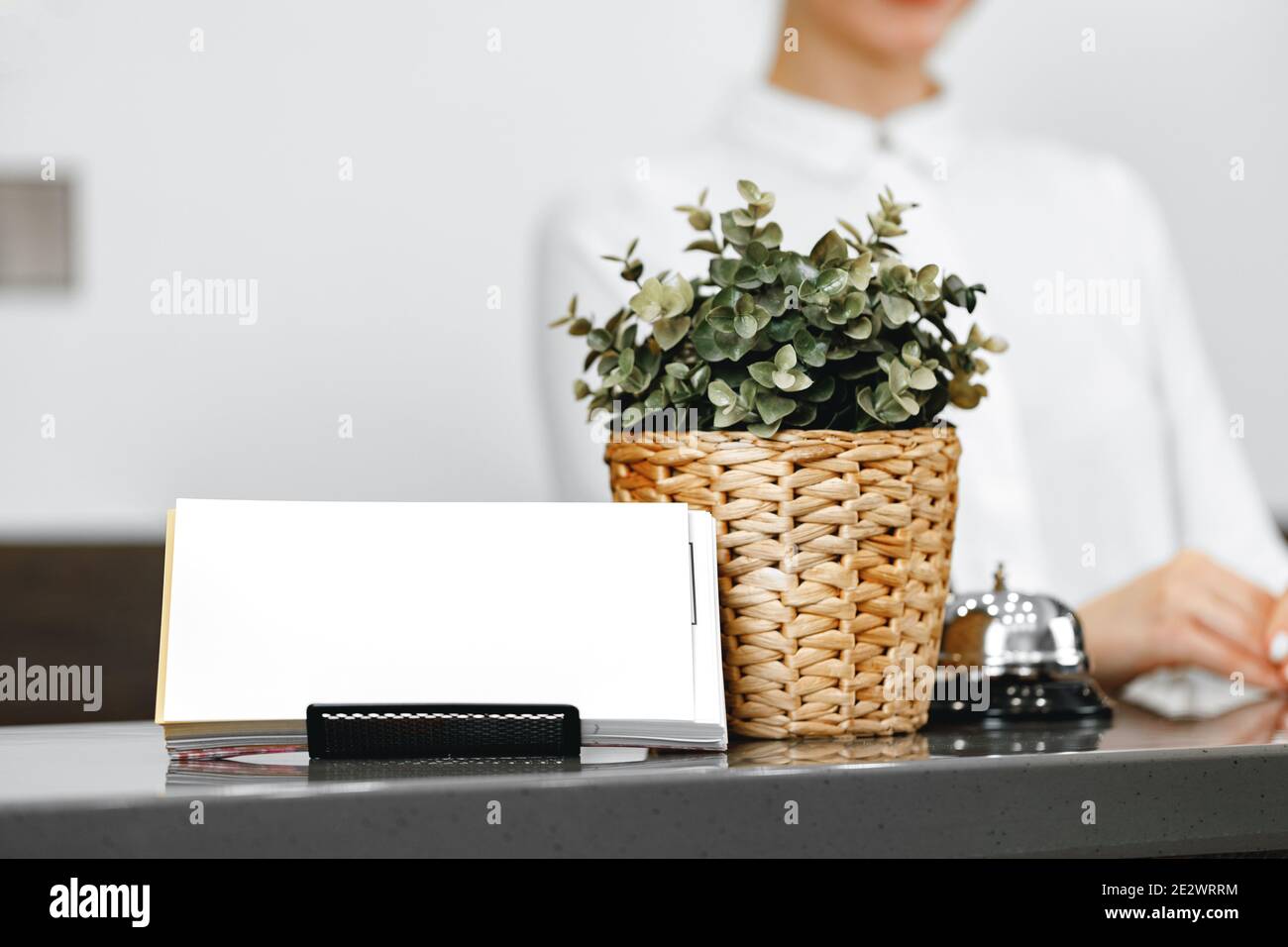 Close up of modern hotel reception counter desk Stock Photo - Alamy