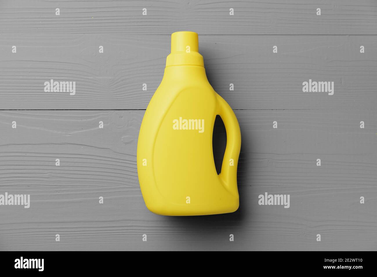 Yellow liquid detergents containers on gray background Stock Photo - Alamy