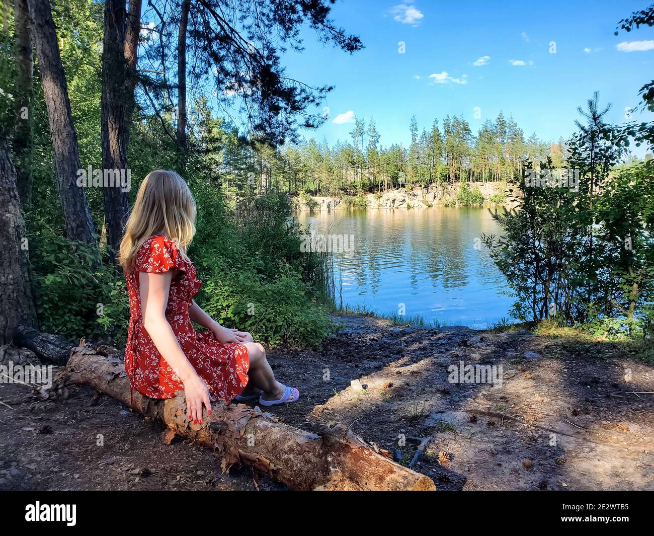 Girl sitting alone back nature hi-res stock photography and images - Alamy
