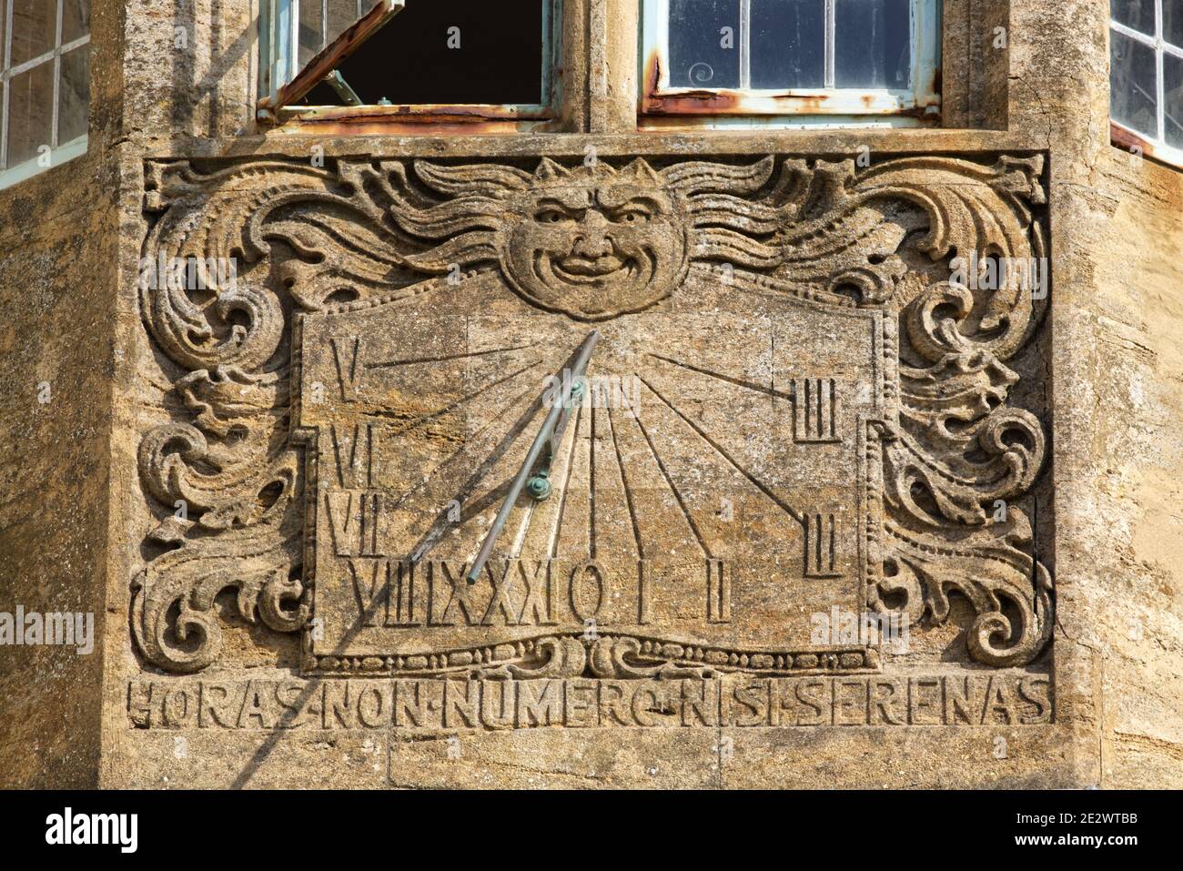 stone sundial and rusty window, Lyme Regis Stock Photo - Alamy