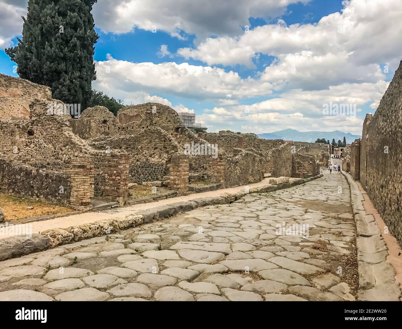 Empty Ancient Roman city of Pompeii under a blue sky with clouds ...