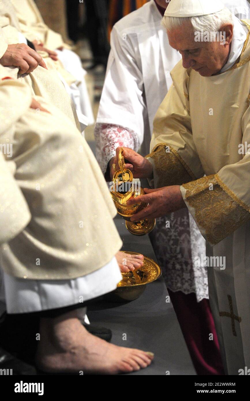 Pope Benedict XVI celebrates the foot washing service during the mass ...