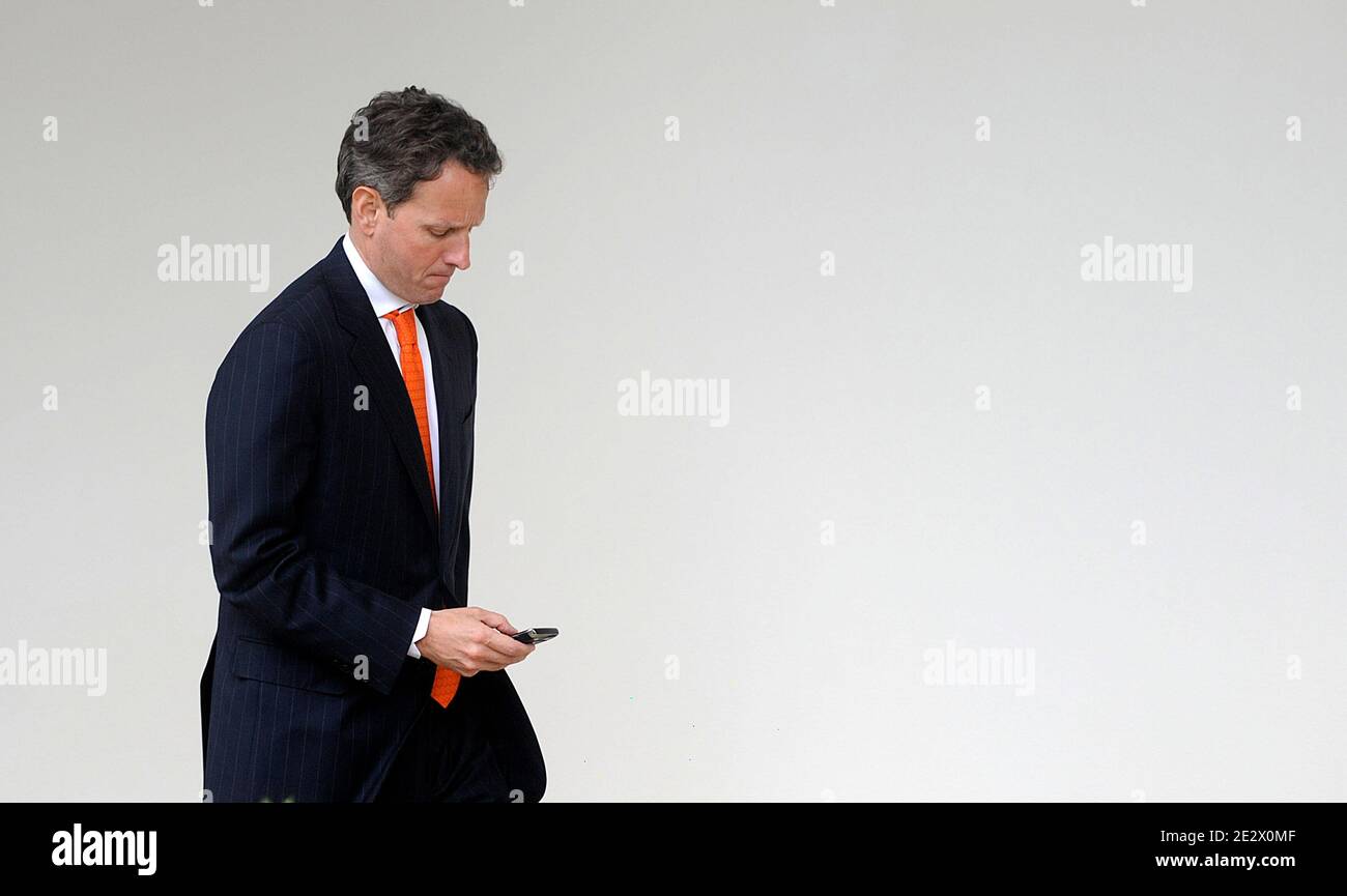 Treasury Secretary Timothy Geithner walks the colonades in the Rose ...