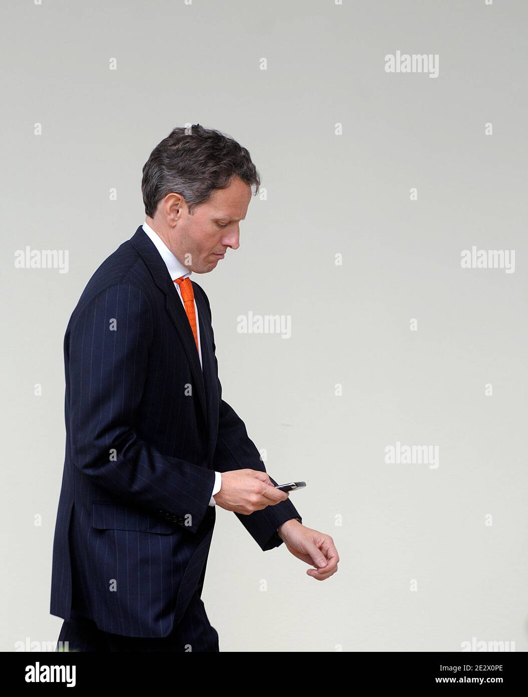 Treasury Secretary Timothy Geithner walks the colonades in the Rose ...
