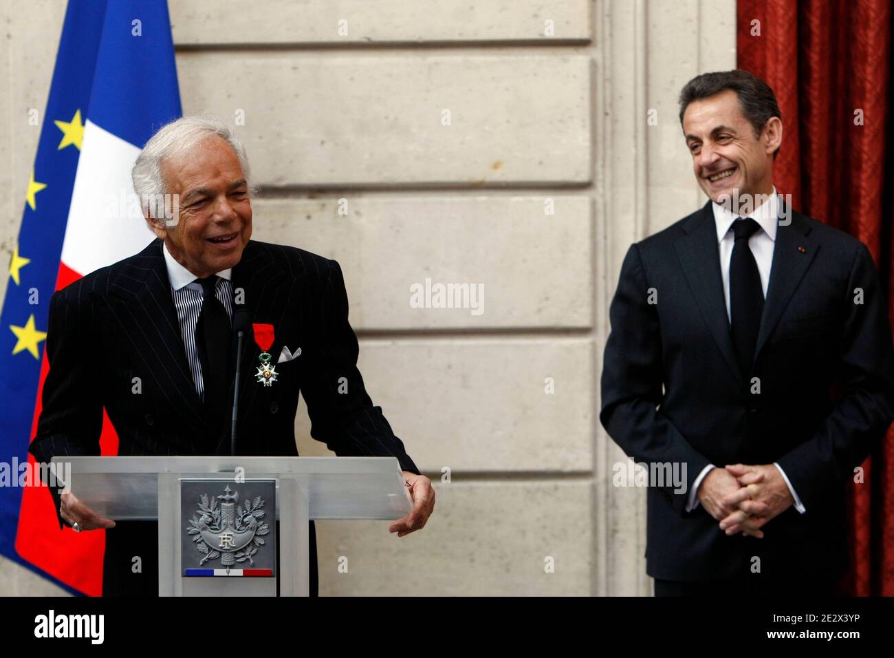 U.S. fashion designer Ralph Lauren, left, delivers his speech after ...