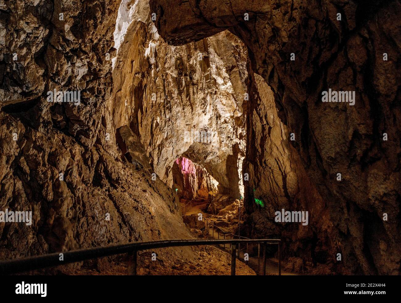 Beautiful view of a narrow pathway inside a natural cave Stock Photo ...
