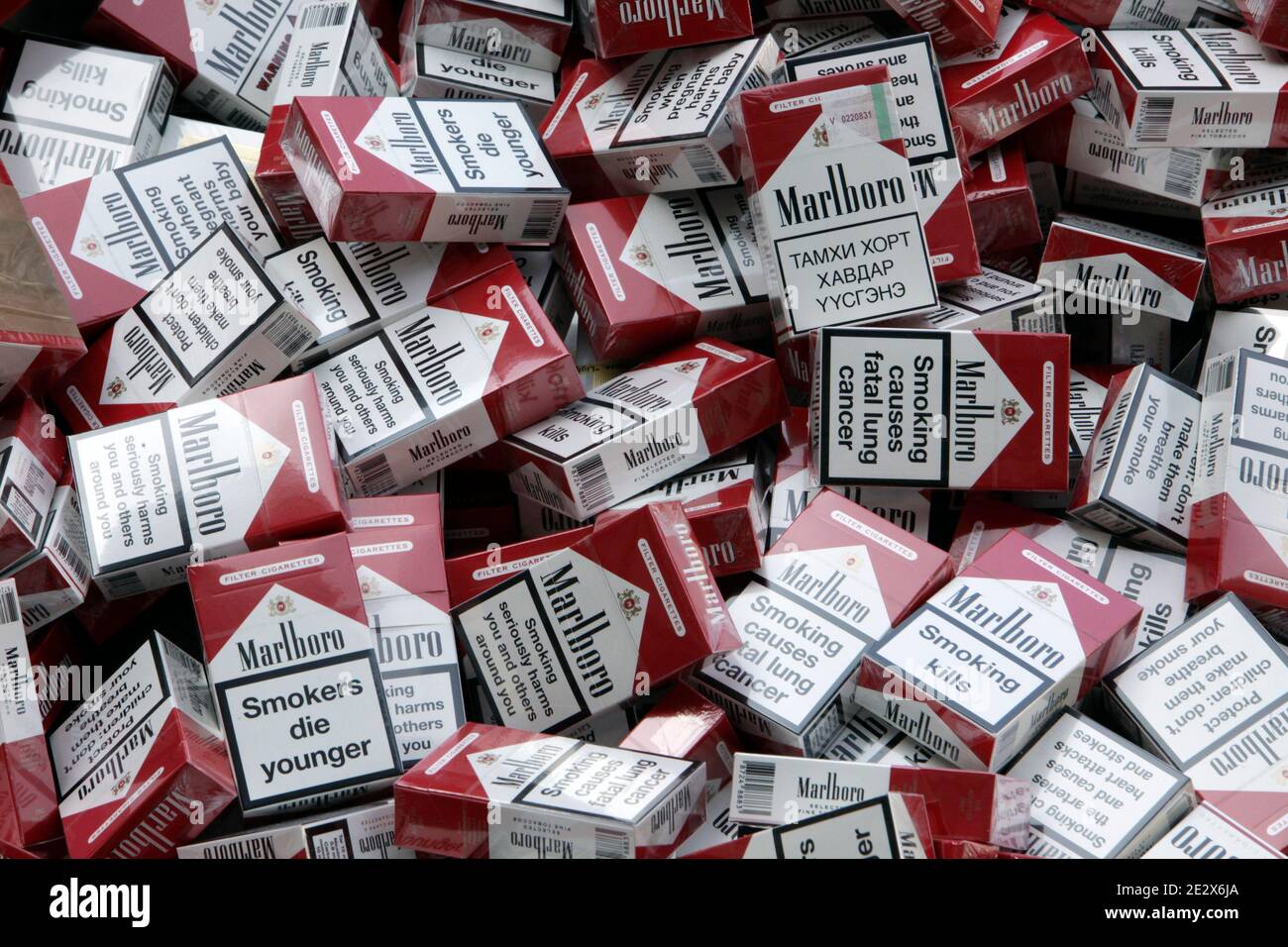 Counterfeit cigarettes seized by Customs are displayed outside ...