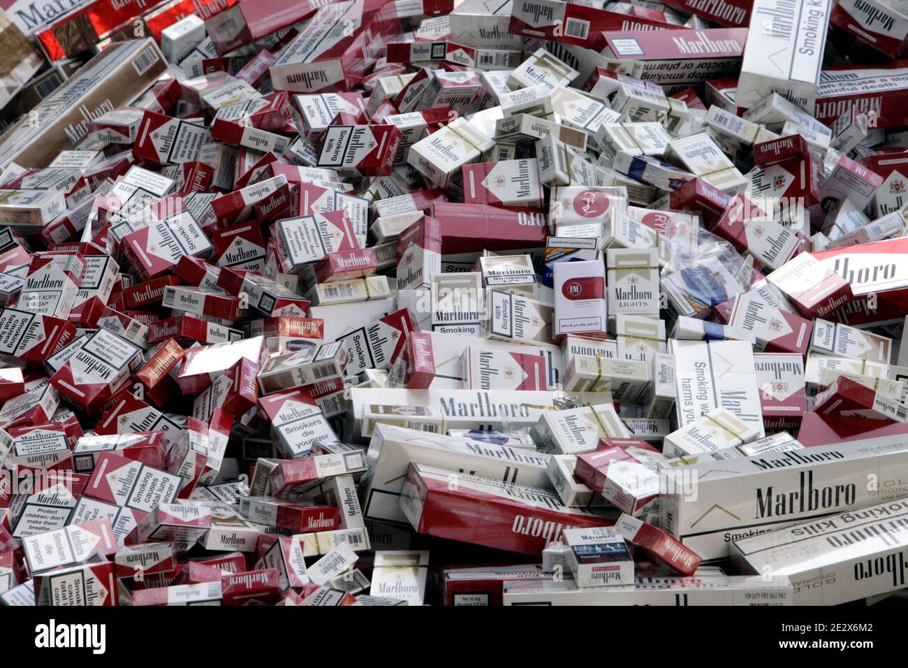 Counterfeit cigarettes seized by Customs are displayed outside ...