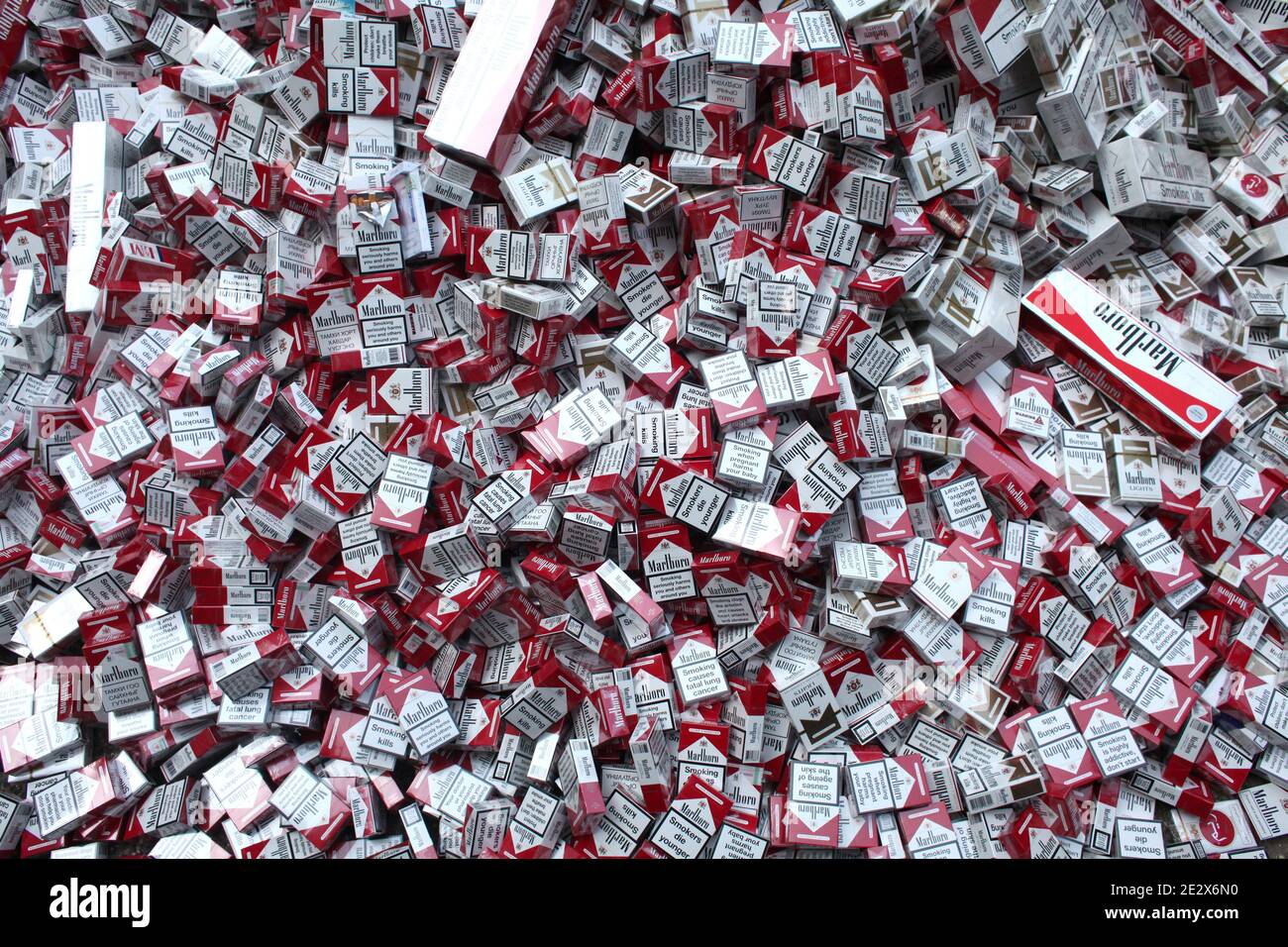 Counterfeit cigarettes seized by Customs are displayed outside ...