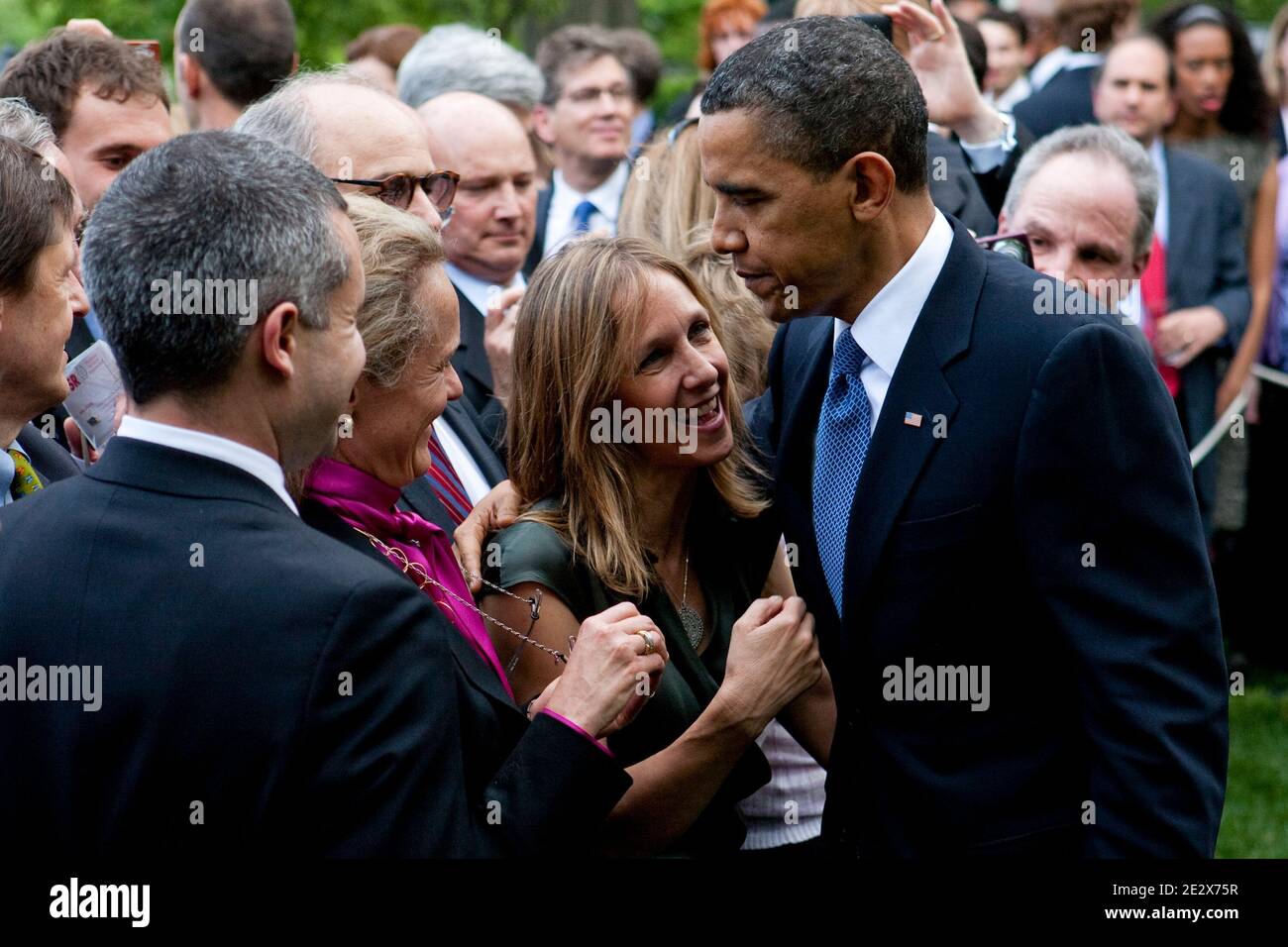 President Barack Obama hugs an audience member following remarks at an ...