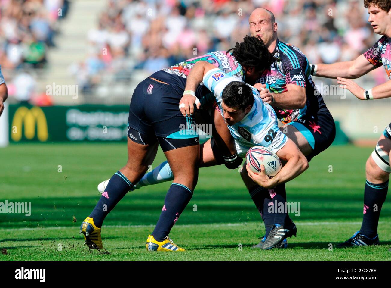 Stade Francais's Mathieu Bastareaud battles Racing-Metro's Andrea Masi ...