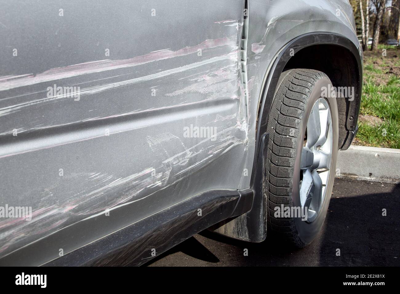 details of the damage to the car in the incident, a scratched door and ...