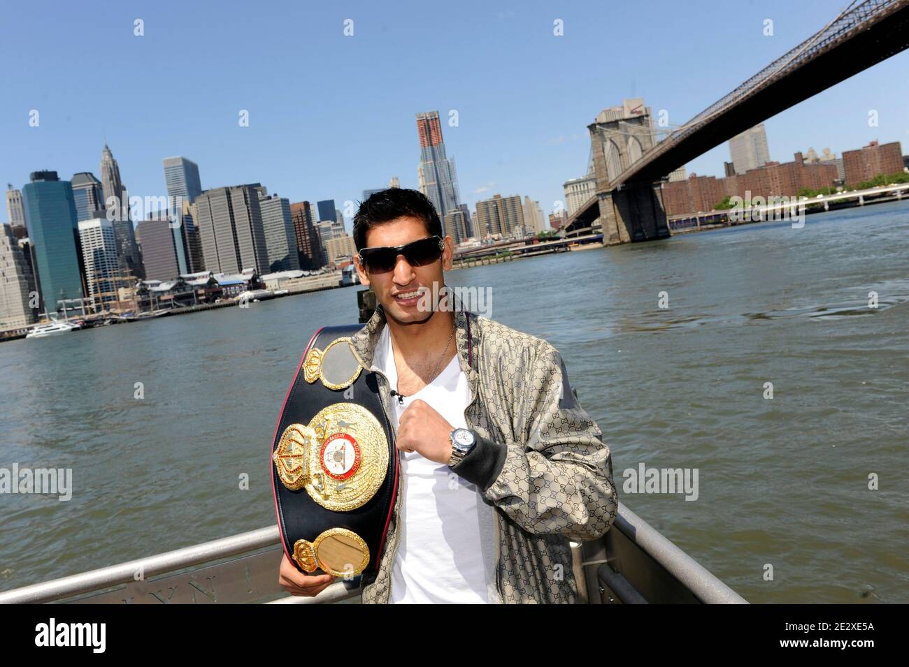 British boxer Amir Khan poses with the WBA World light welterweight ...