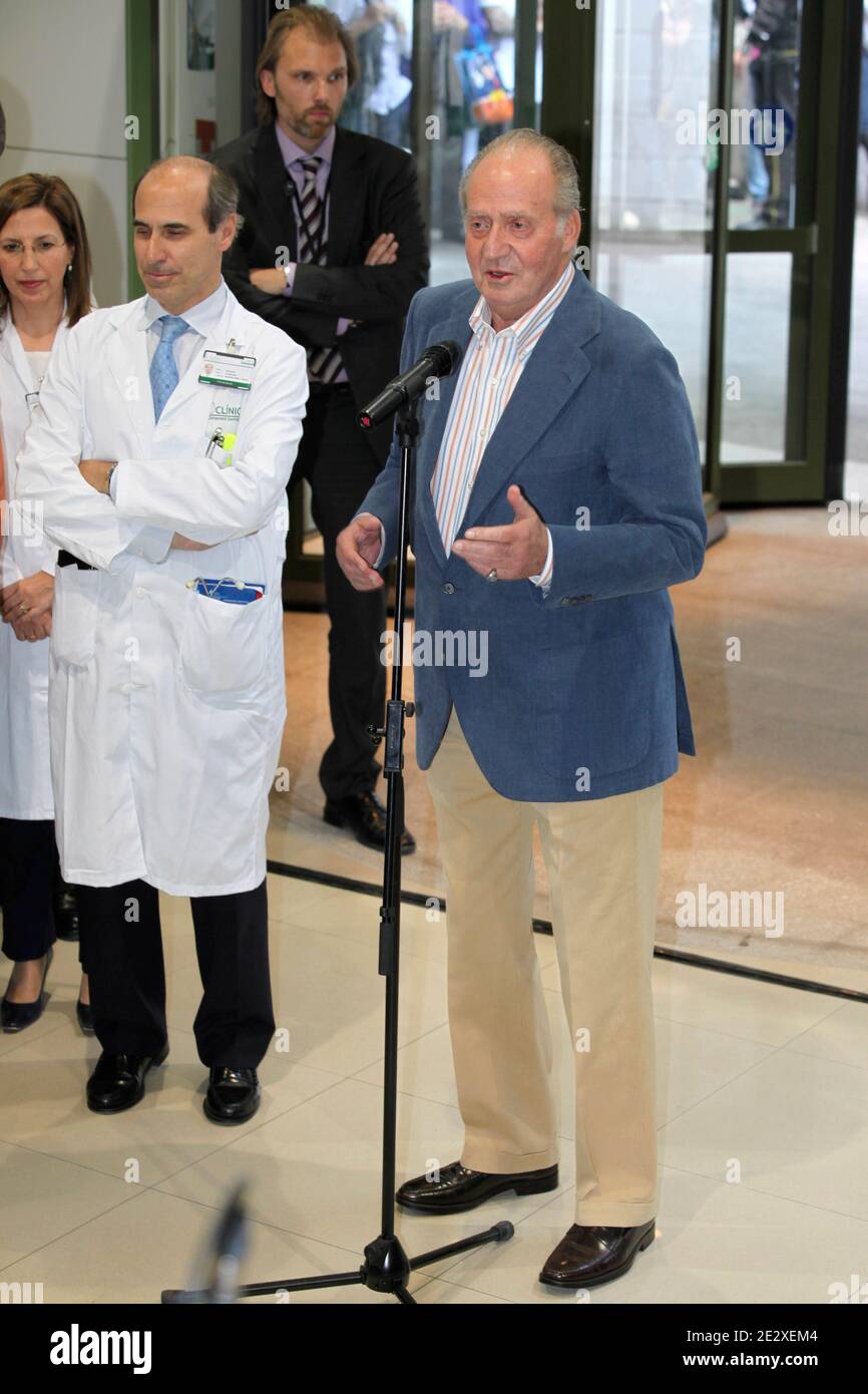 Spain's King Juan Carlos I speaks to the press as he leaves the Clinic ...
