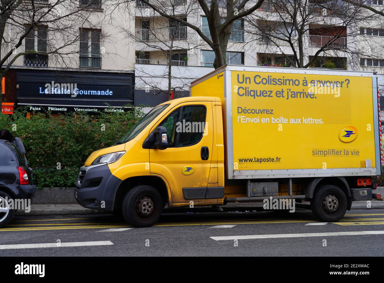 PARIS, FRANCE -5 JAN 2021- View of a La Poste mail delivery van on the ...