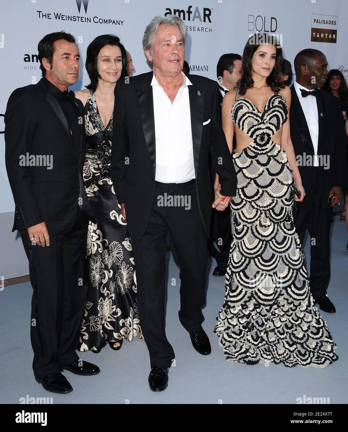 Bernard Montiel and Alain Delon attending the amfAR's Cinema Against ...
