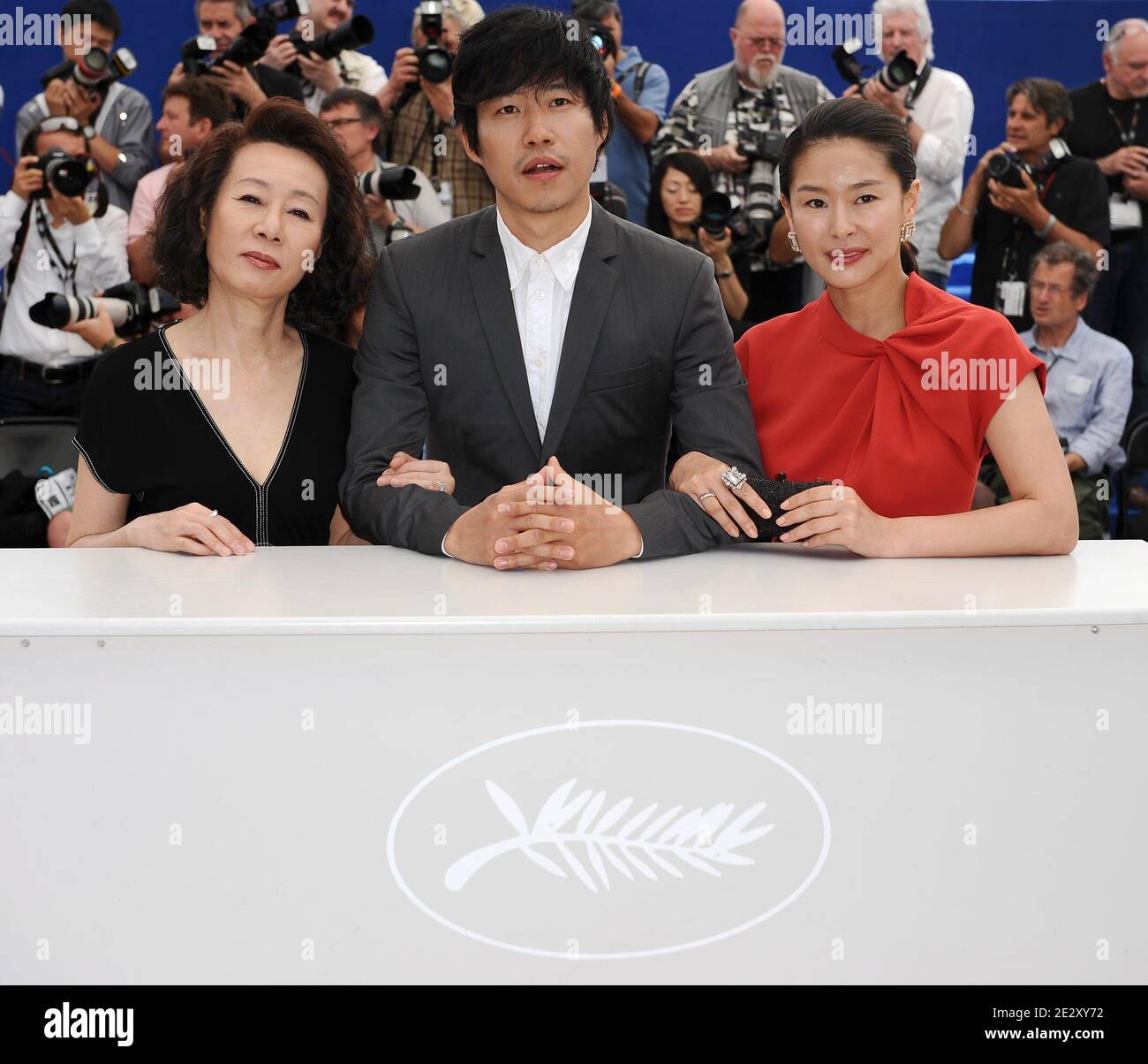 (L-R) Yuh-Jung Youn, Joonsang Yu and Jiwon Ye during the photocall of ...