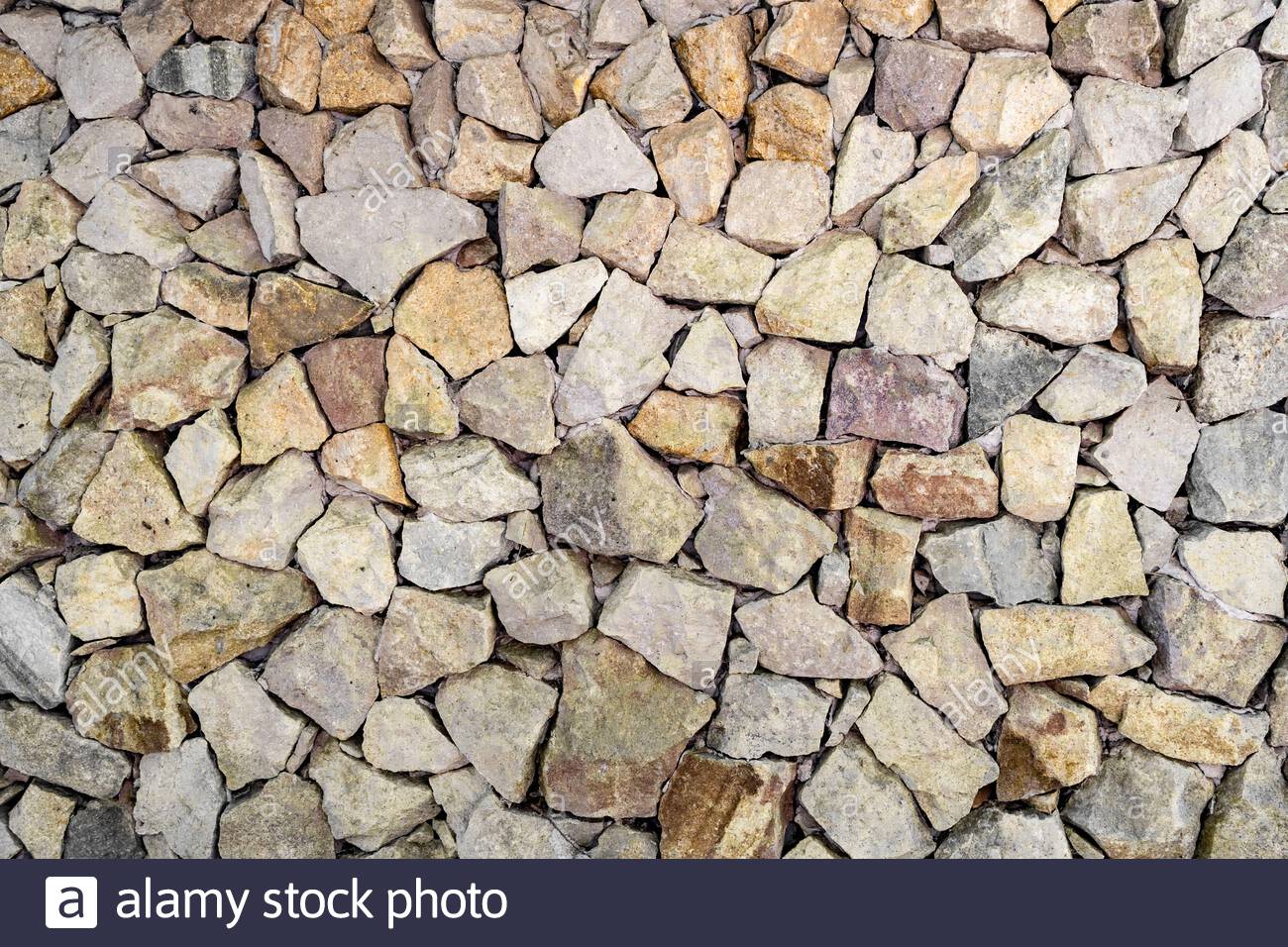Multicolored stone wall. Textured background Stock Photo - Alamy