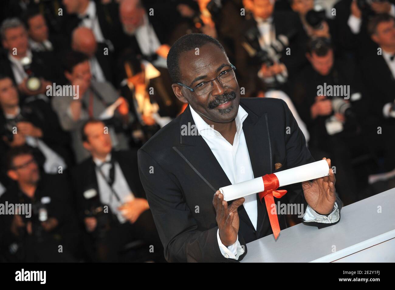 "Director Mahamat-Saleh Haroun poses with his Jury Prize for the film ...