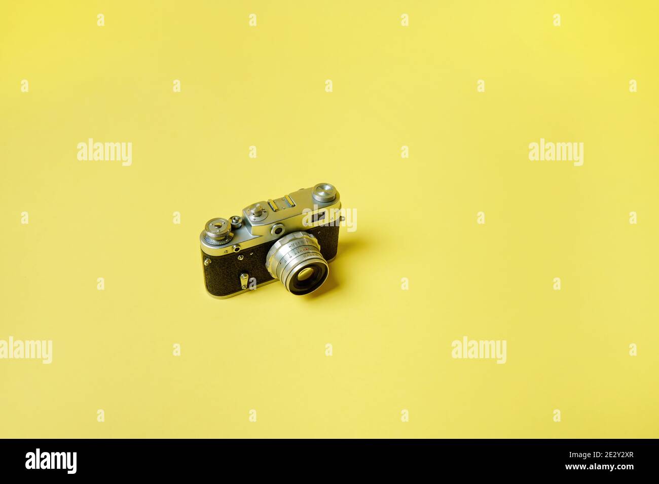 Top view of an old model film camera isolated on a yellow background ...